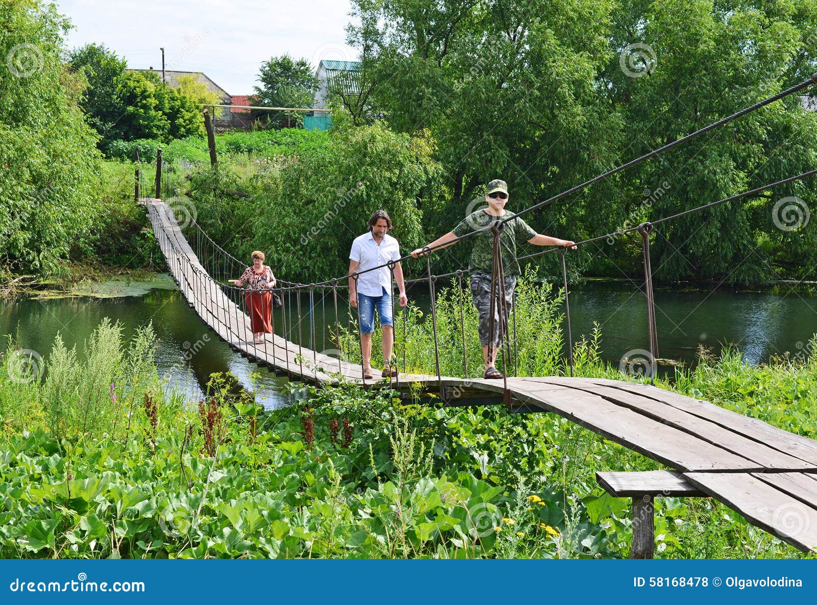 People Walk on Suspension Bridge Over the River Stock Photo - Image of ...