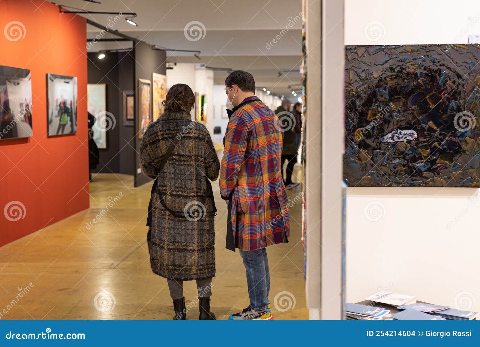 People Walking and Admiring Paintings in a Modern Art Gallery Editorial ...