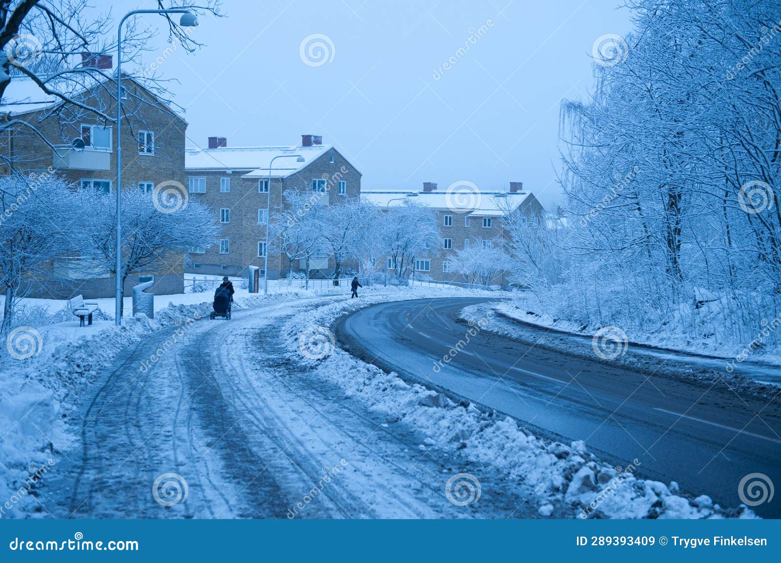 People Walking Along a Curved Road on a Cold Winter Day.. Stock Image ...