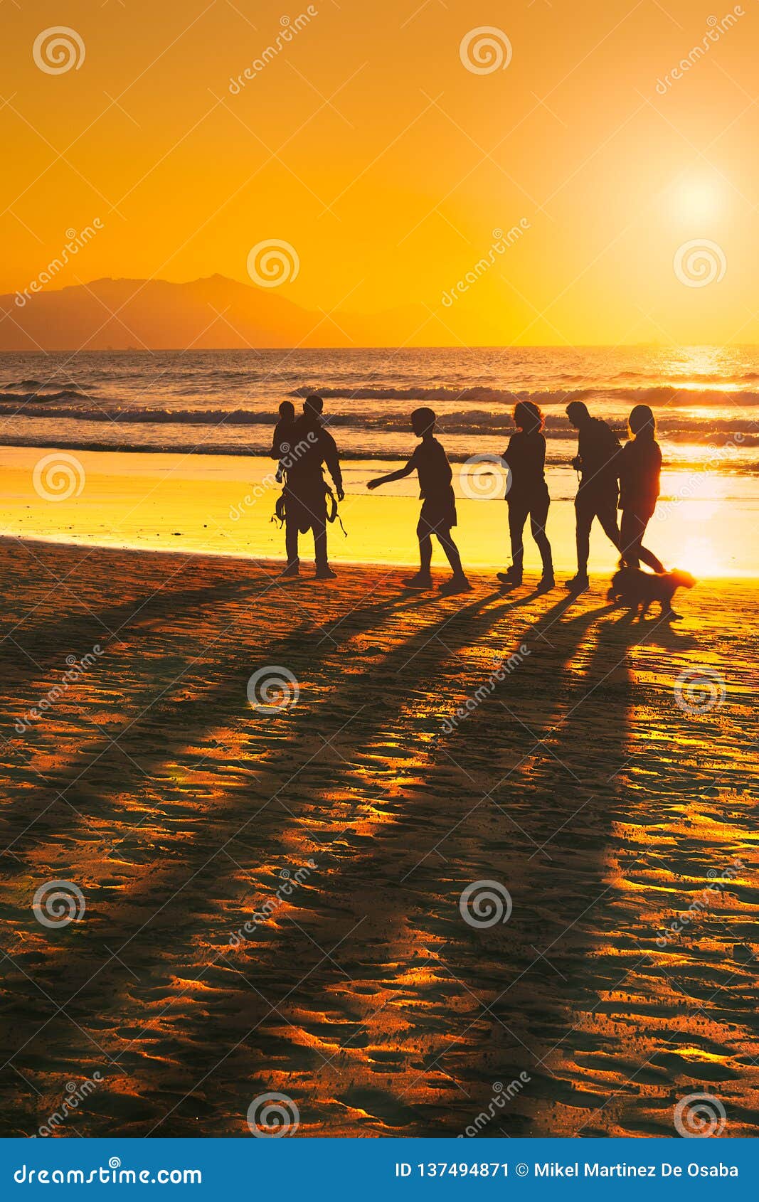 People Walking on the Beach Stock Image - Image of mother, sunset ...