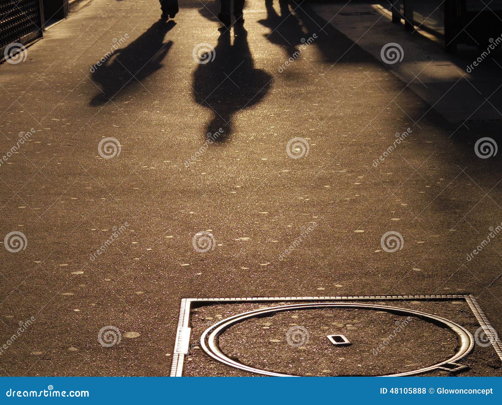 People Walking Shadow Cast on Street Stock Photo - Image of group, hole ...