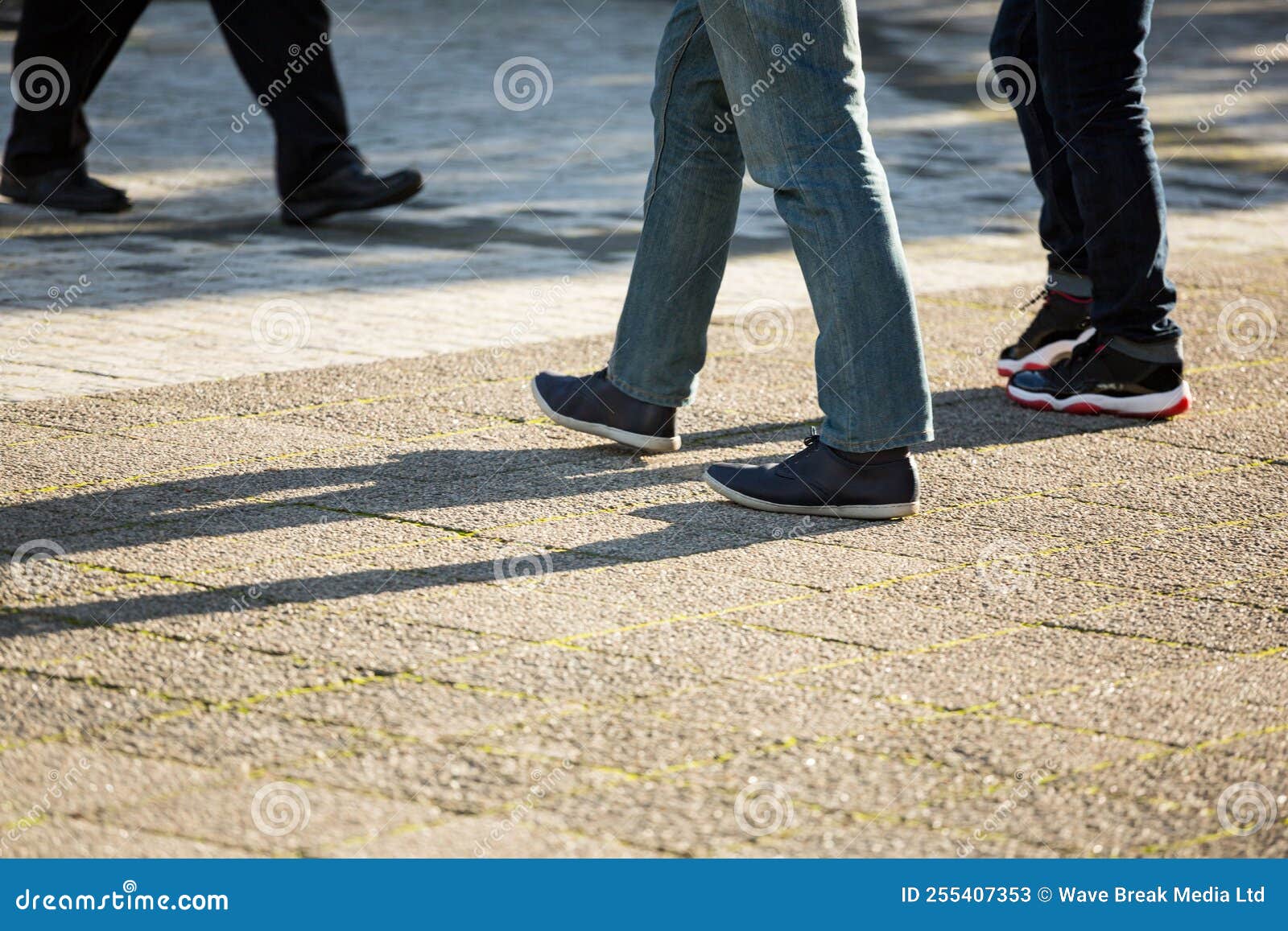 People walking on sidewalk stock image. Image of sidewalk - 255407353