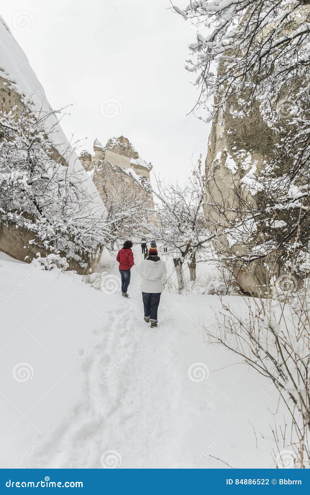 People walking on snow stock photo. Image of rock, park - 84886522