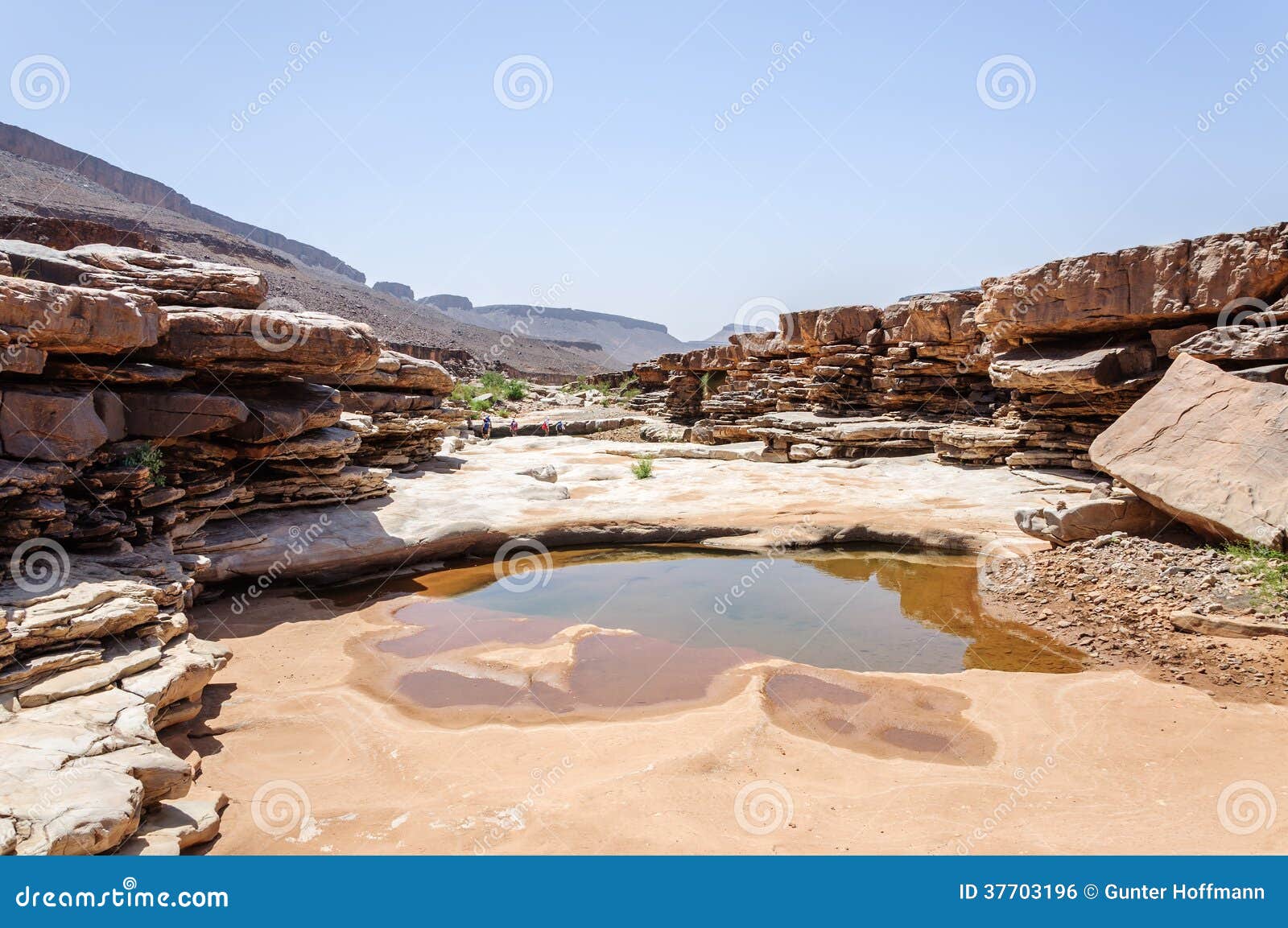 People Walking on the Stone River, Draa Valley (Morocco) Stock Photo ...
