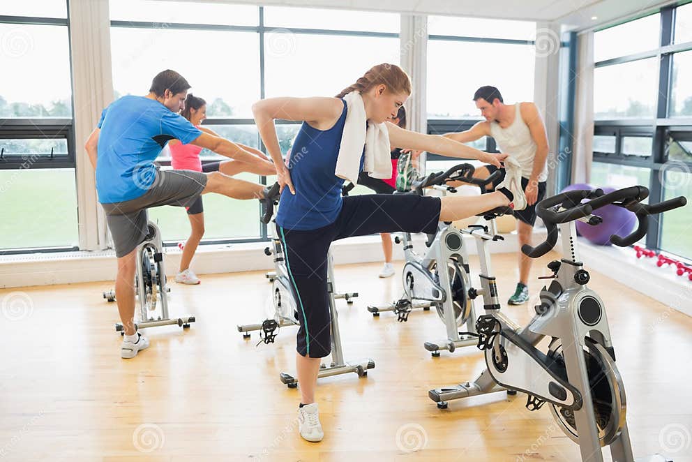 People Warming Up by Exercise Bikes in Spinning Class Stock Photo ...