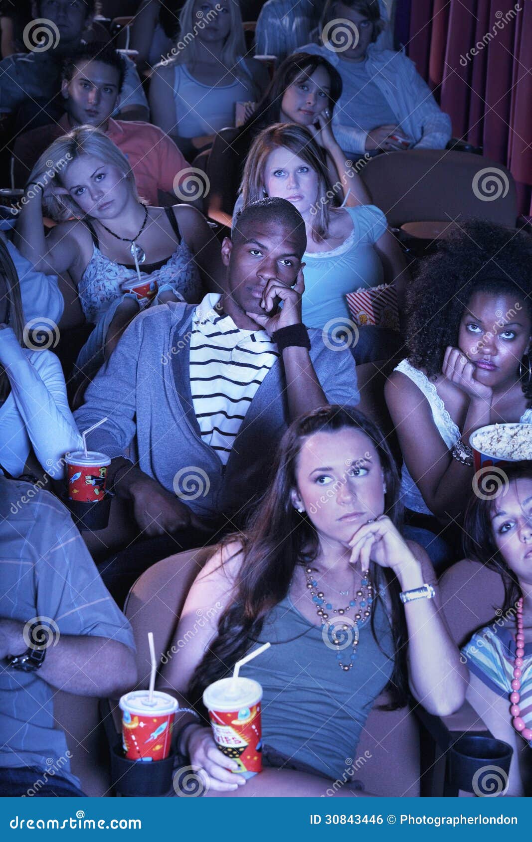 People Watching a Boring Movie Stock Photo - Image of beverage, black ...