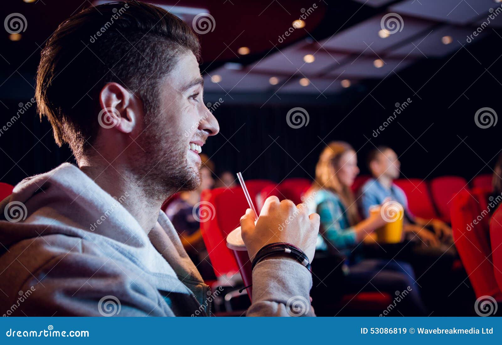 People watching a film stock image. Image of engrossed - 53086819