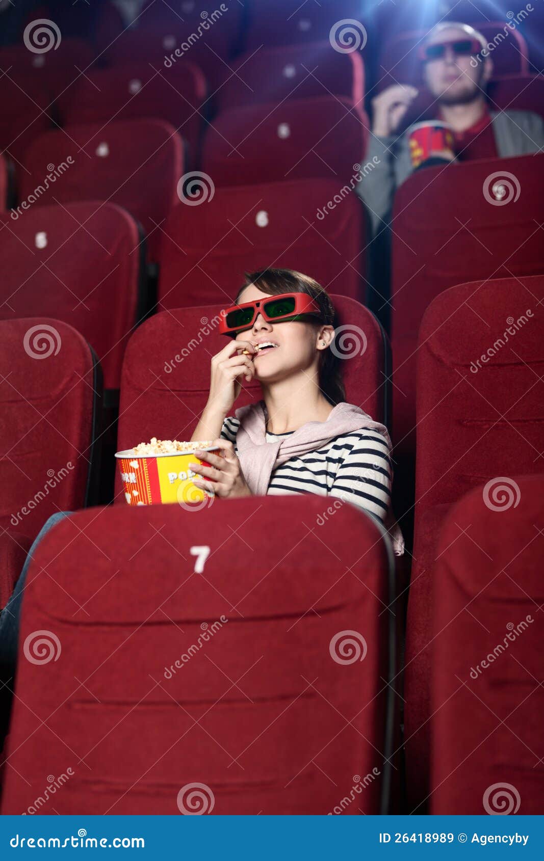 People watching a movie stock image. Image of brunette - 26418989