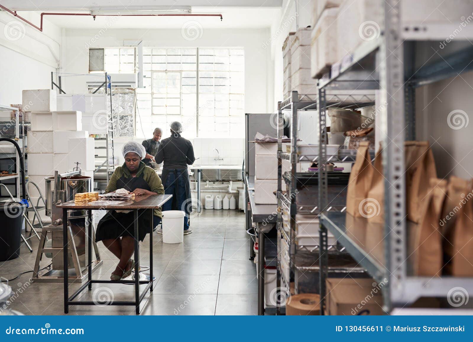 People at Work Together in an Artisanal Chocolate Making Factory Stock ...