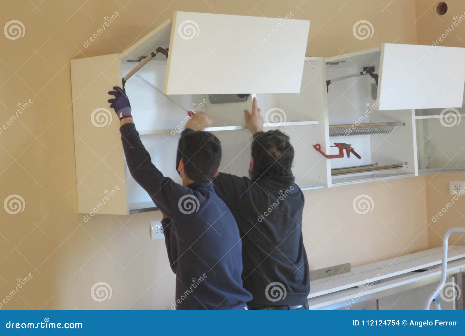 People Workers Trying To Install a Kitchen Editorial Stock Image ...