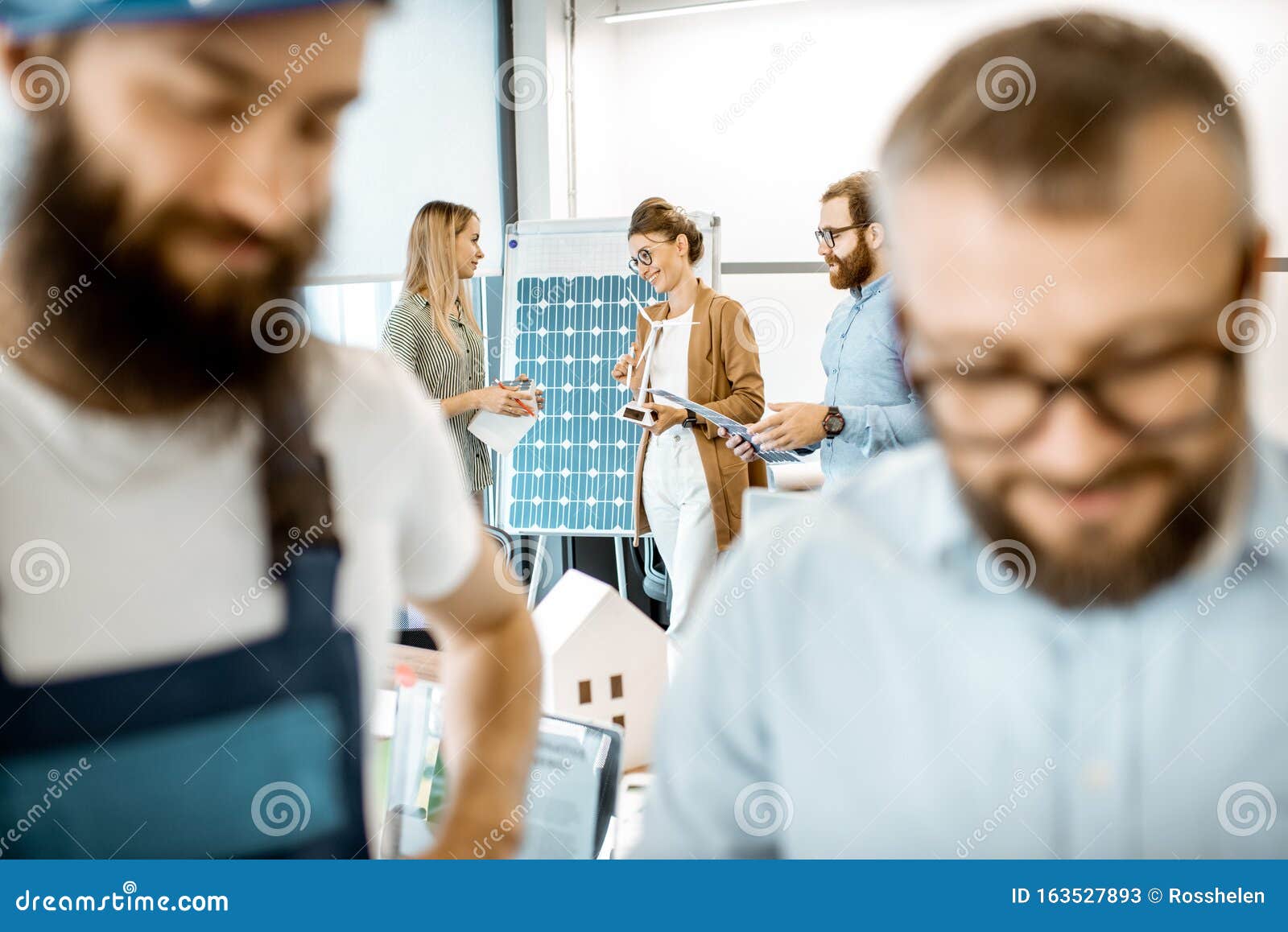 People Working on Alternative Energy Project in the Office Stock Image ...