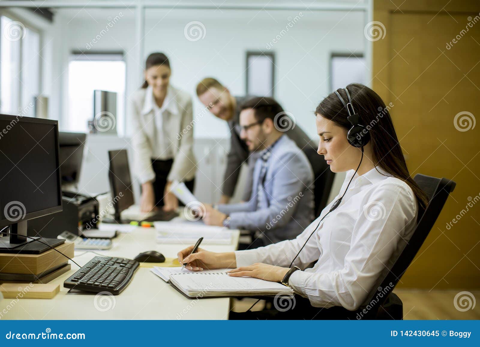 People Working in a Busy Office Stock Image - Image of listen ...