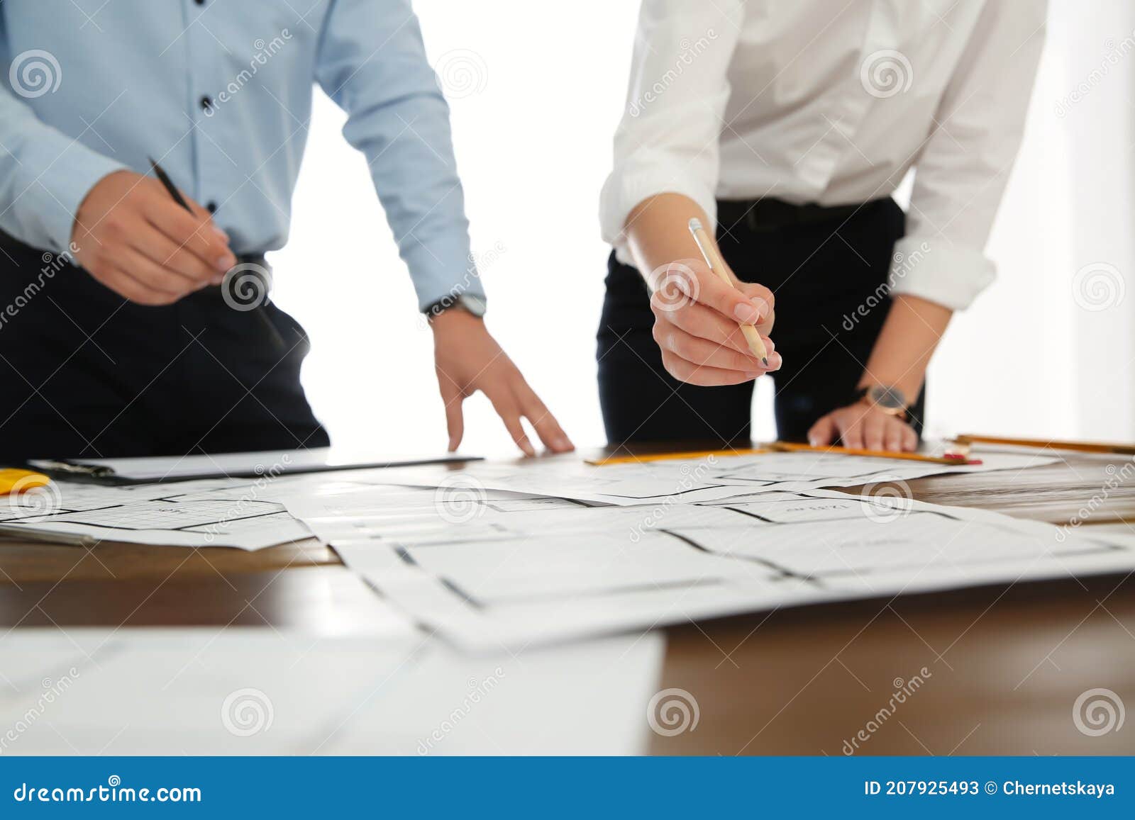 People Working with Construction Drawings at Table, Closeup Stock Image ...