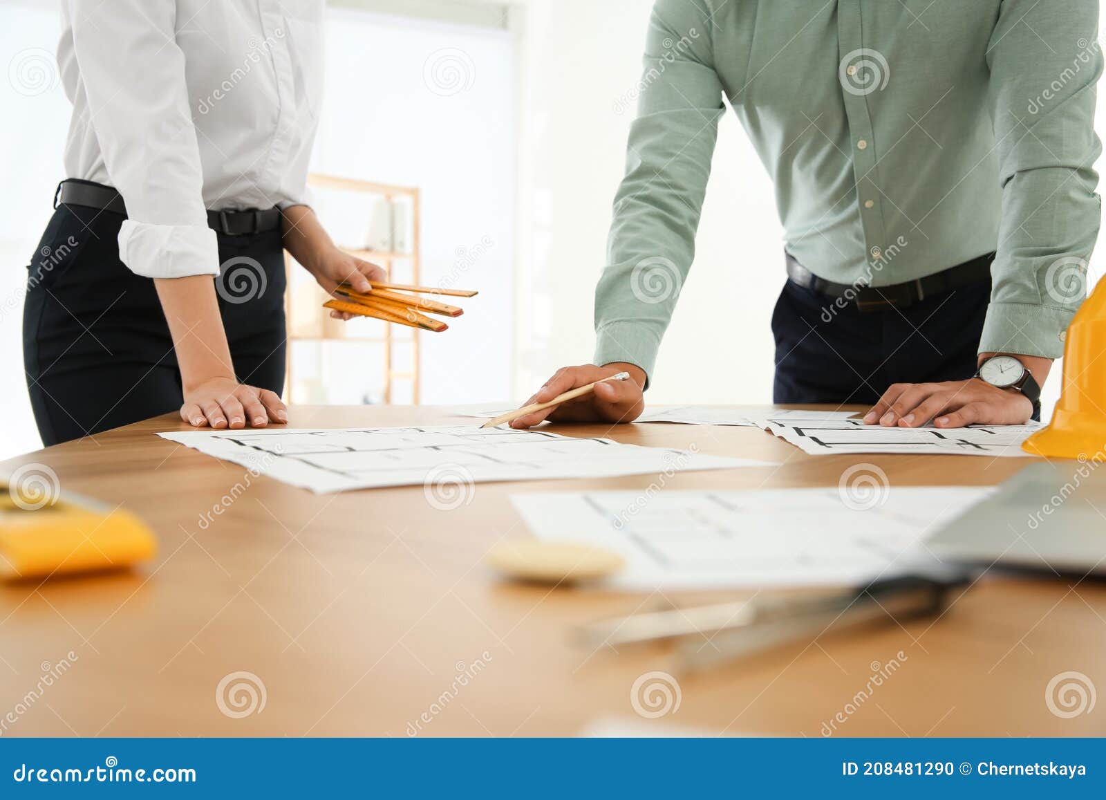 People Working with Construction Drawings at Table, Closeup Stock Photo ...