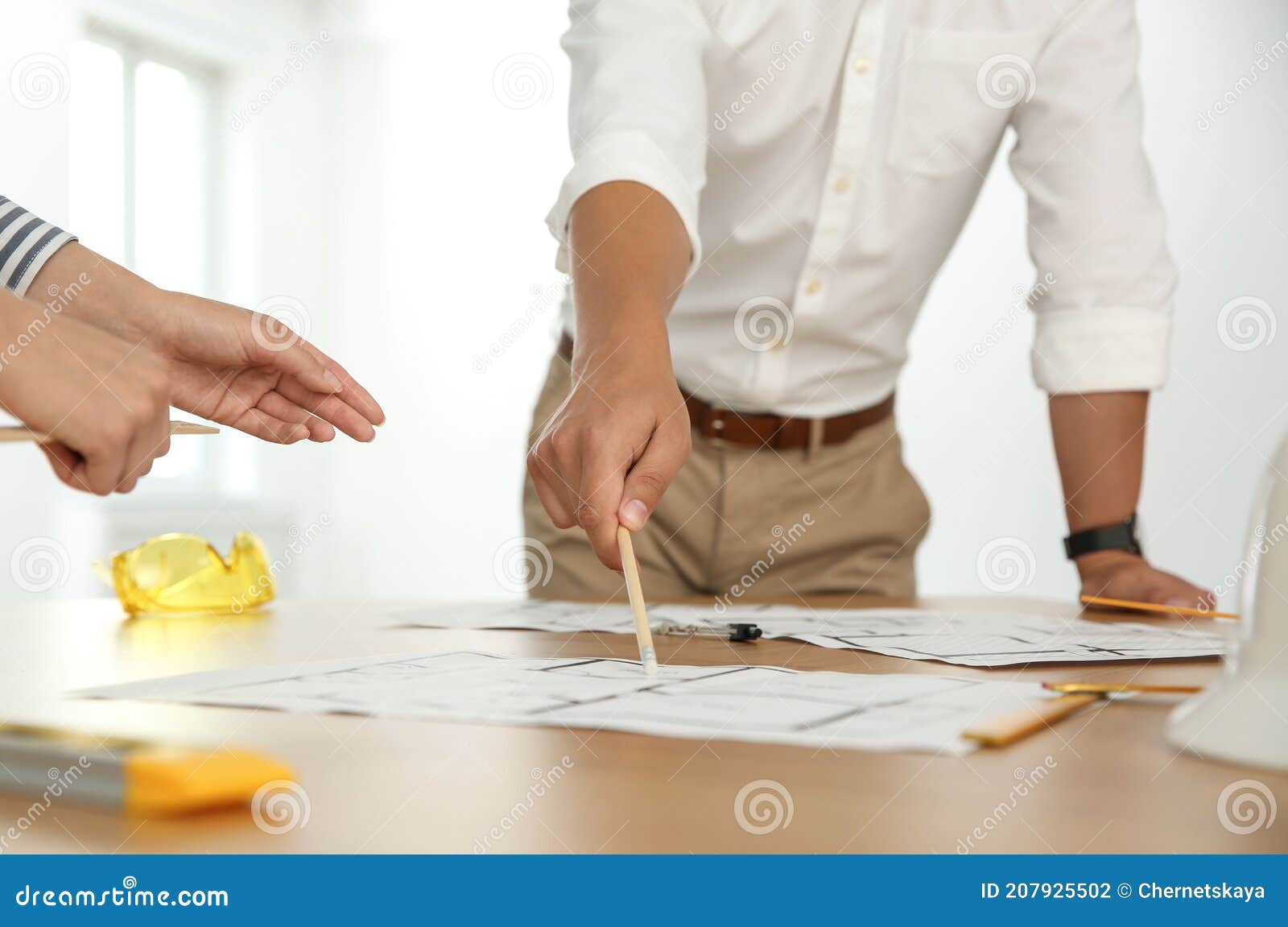 People Working with Construction Drawings at Table, Closeup Stock Photo ...