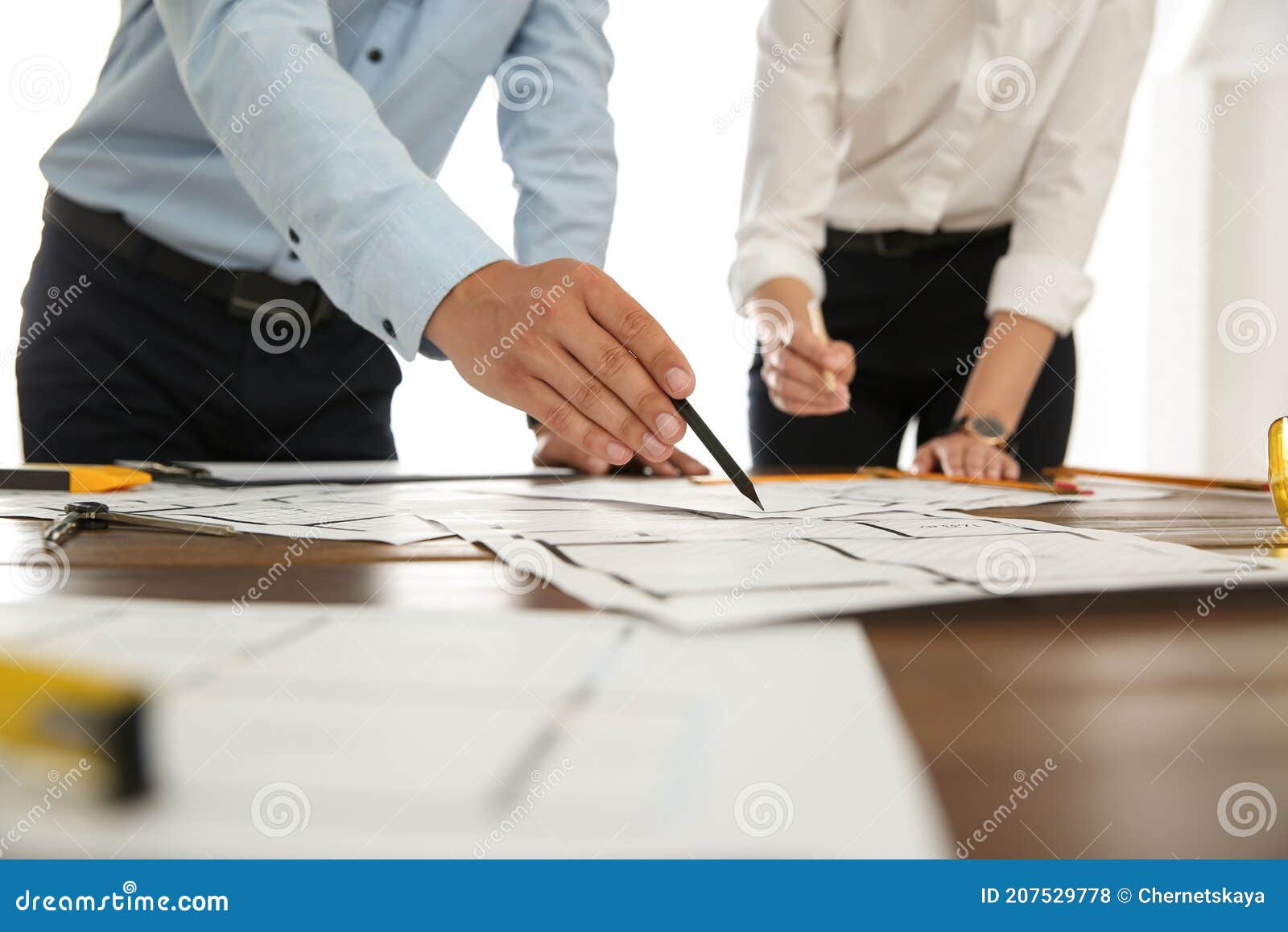 People Working with Construction Drawings at Table, Closeup Stock Photo ...
