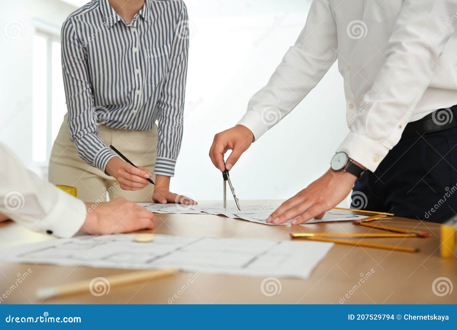 People Working with Construction Drawings at Table, Closeup Stock Photo ...