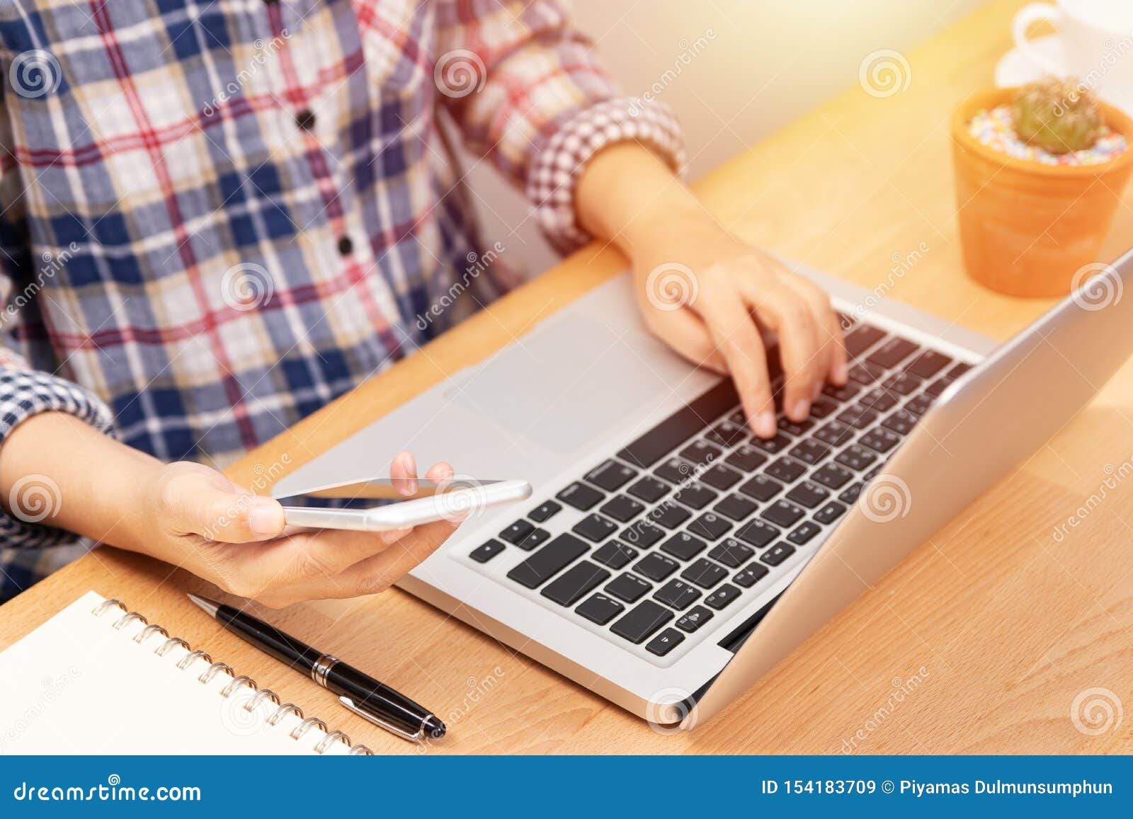 People Working from Home Using Smart Phone and Notebook Laptop Computer ...