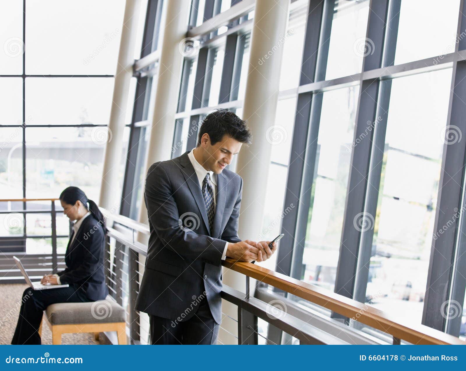 People Working on Laptop and Text Messaging Stock Photo - Image of ...