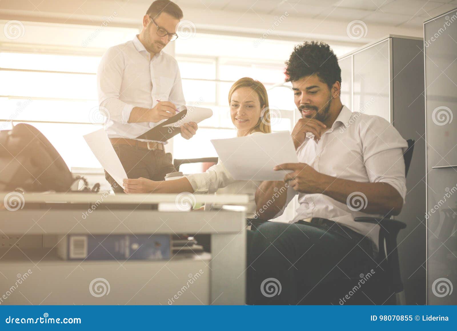 People Working in Office. Business People Having Readin Stock Image ...