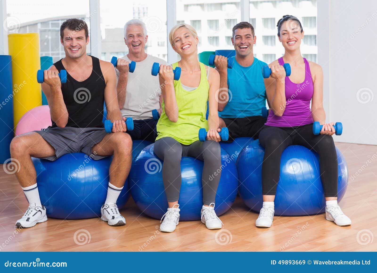 People Working Out on Exercise Balls at Gym Class Stock Image - Image ...