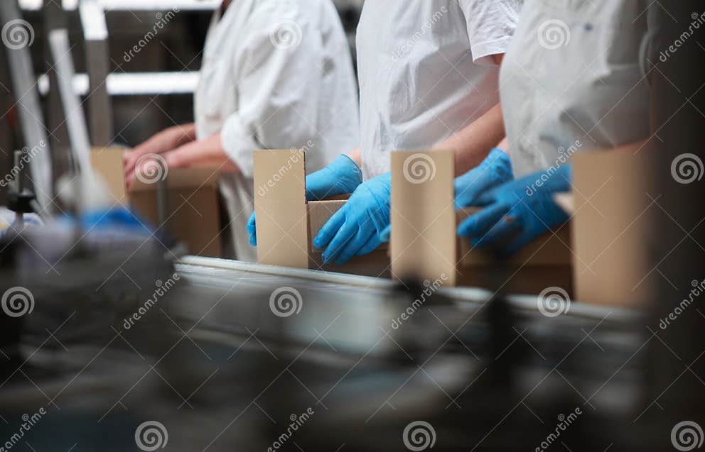 People Working on Packing Line in Factory - Semi Automation Stock Image ...