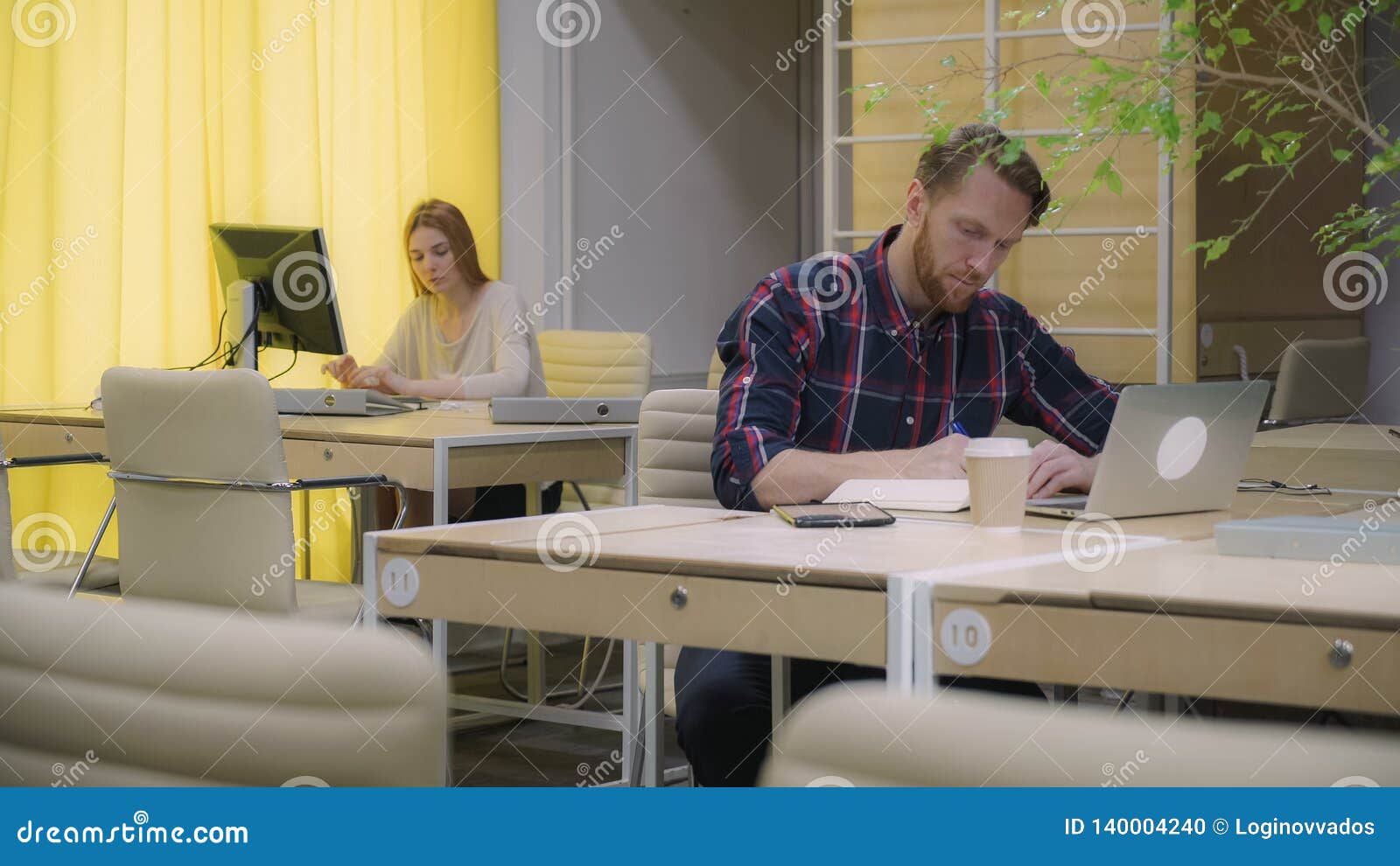 People in the Workplace in a Beautiful Yellow-green Office Stock Photo ...