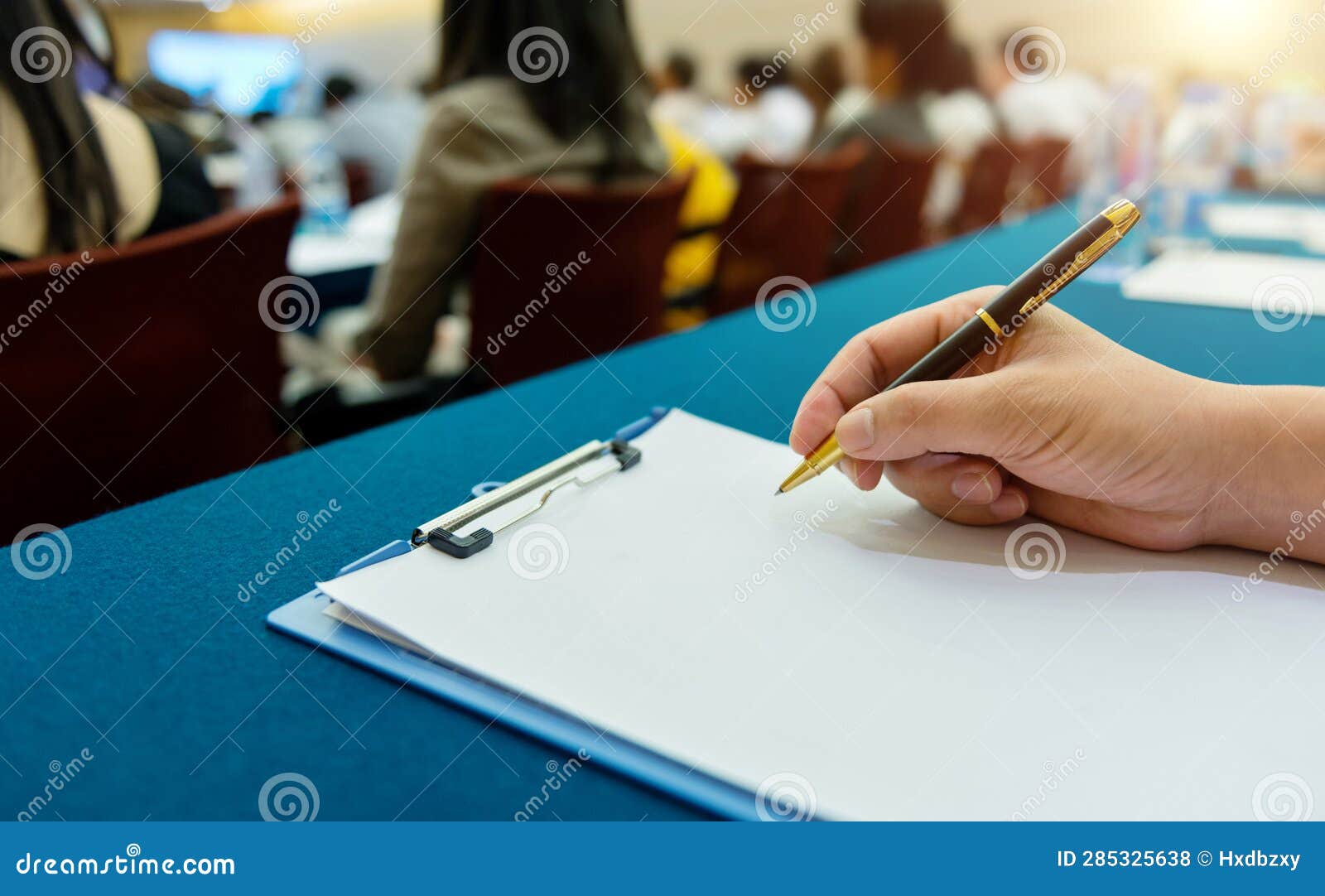 People Writing on Document at Business Seminar Stock Photo - Image of ...