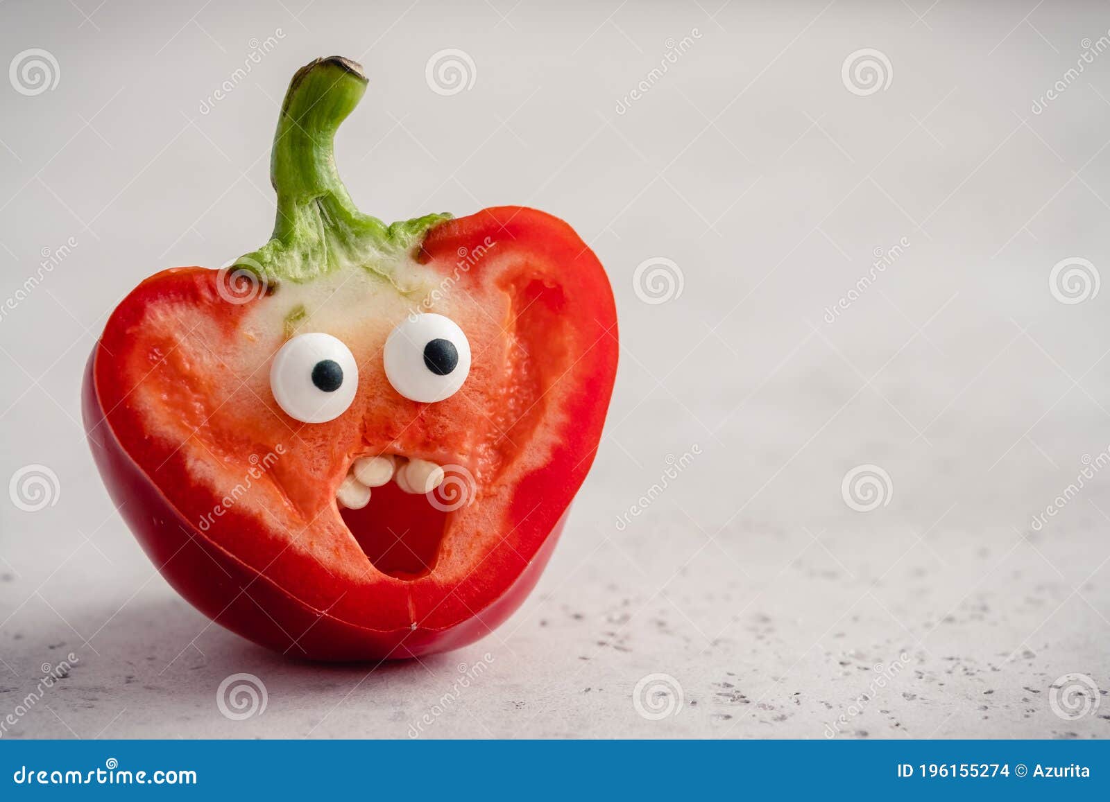Pepper with Funny Face. Surprised Pepper with Googly Eyes Over White ...