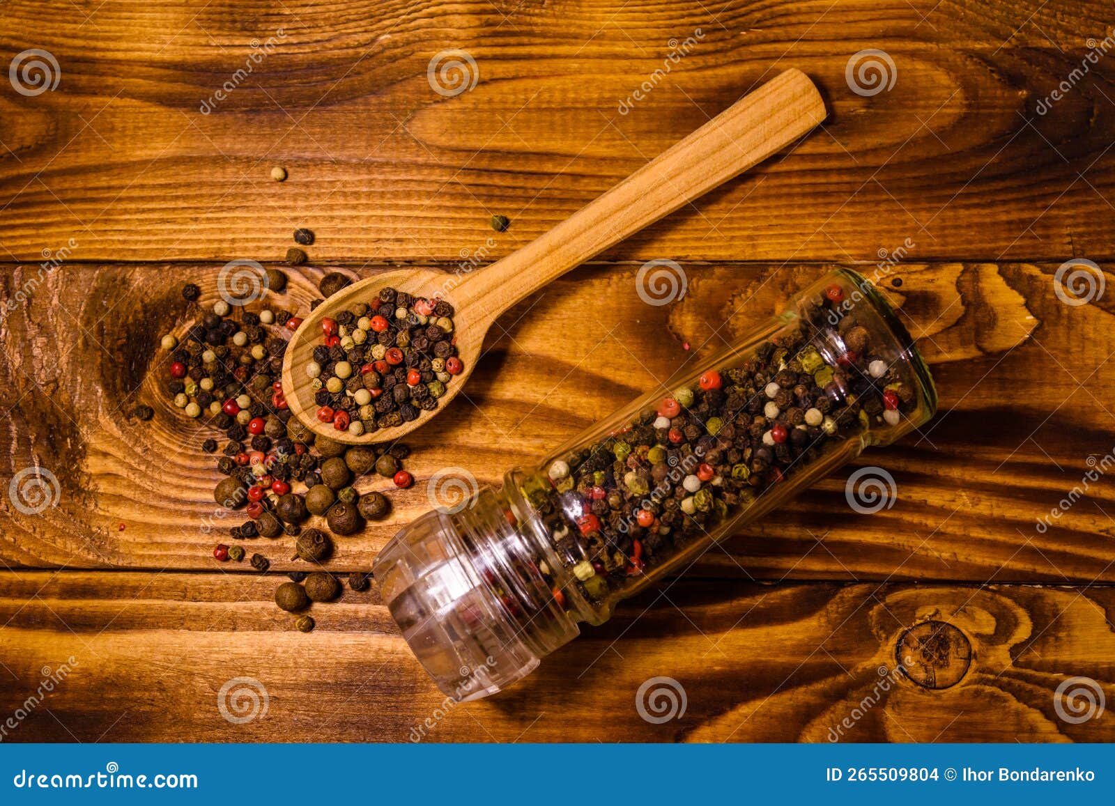 Pepper Mill and Scattered Spices on the Wooden Table. Top View Stock ...