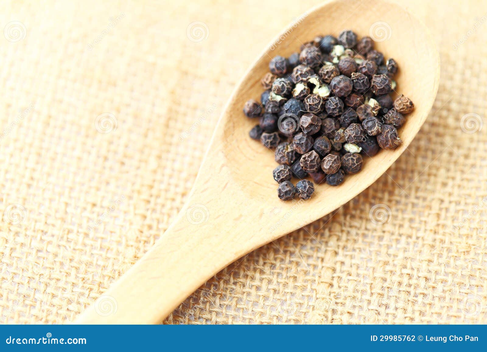 Pepper in wooden spoon stock photo. Image of texture - 29985762