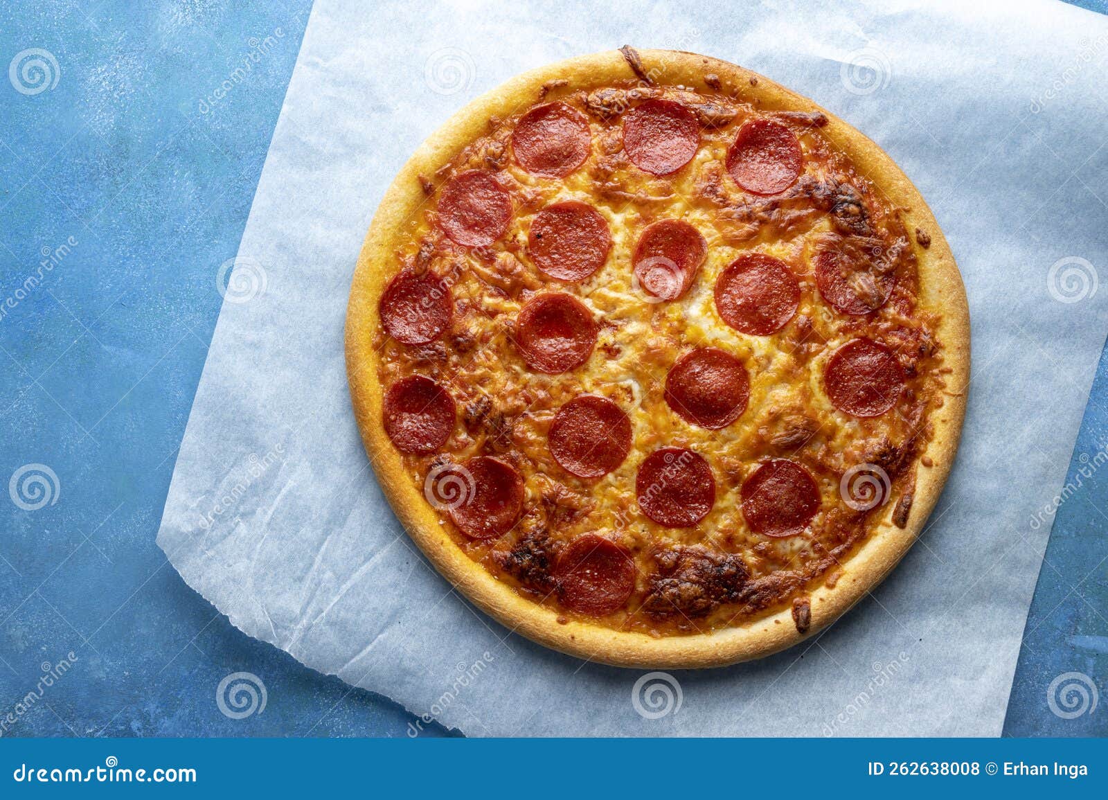 Pepperoni Pizza on Blue Background, One Pizza, Top View Stock Photo ...