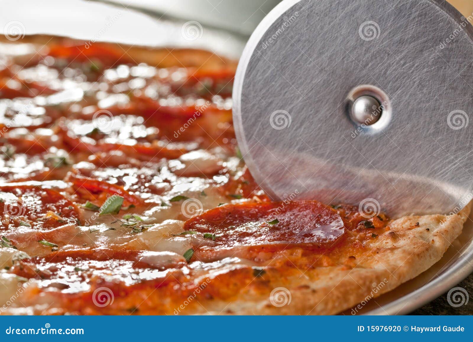 Pepperoni pizza cutter stock photo. Image of italian - 15976920