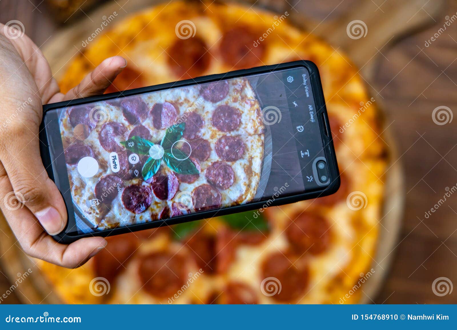 Pepperoni Pizza with Mobile Phone Stock Photo - Image of restaurant ...