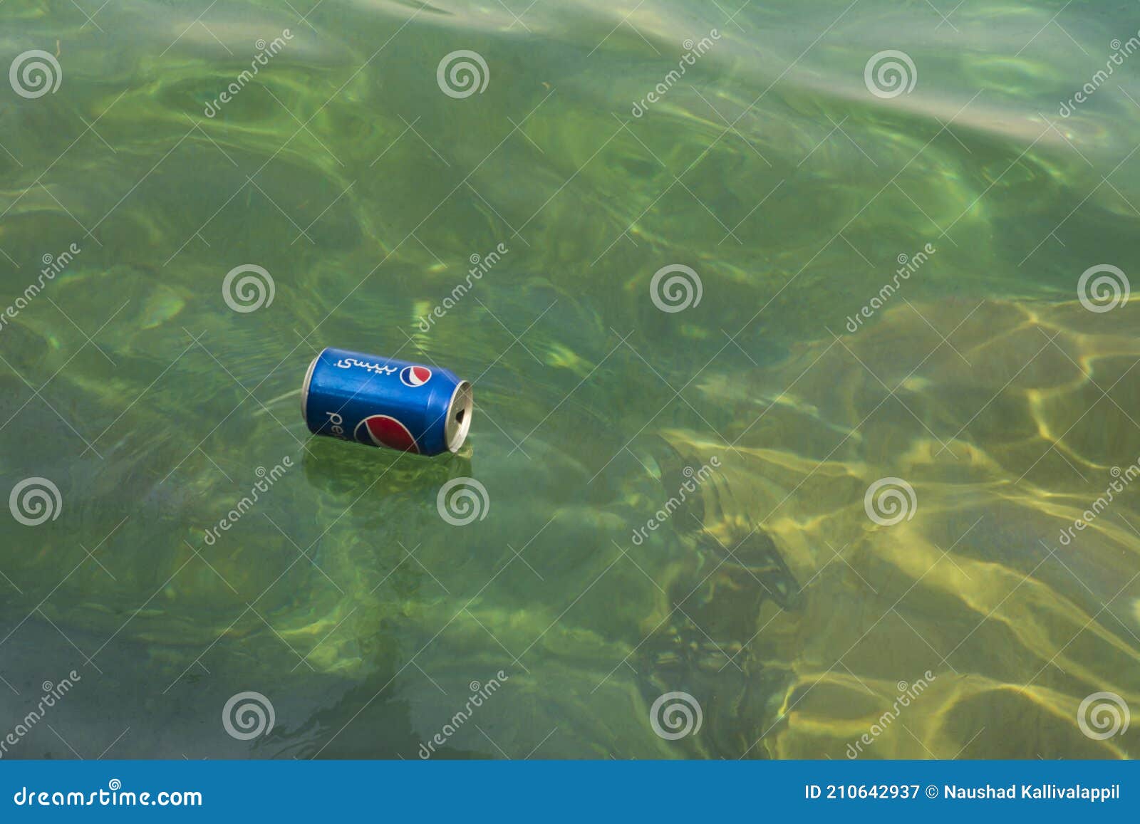 Pepsi bottle on water editorial photography. Image of cola - 210642937