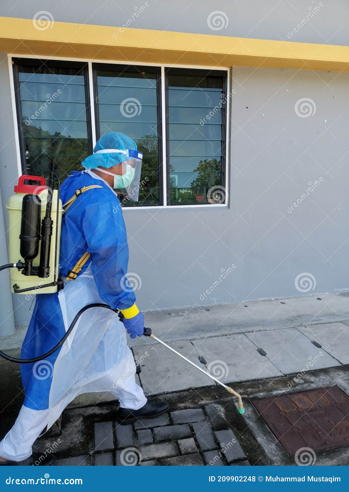 Perak, Malaysia - a Frontliner Sanitizing Covid-19 Sampling Area ...