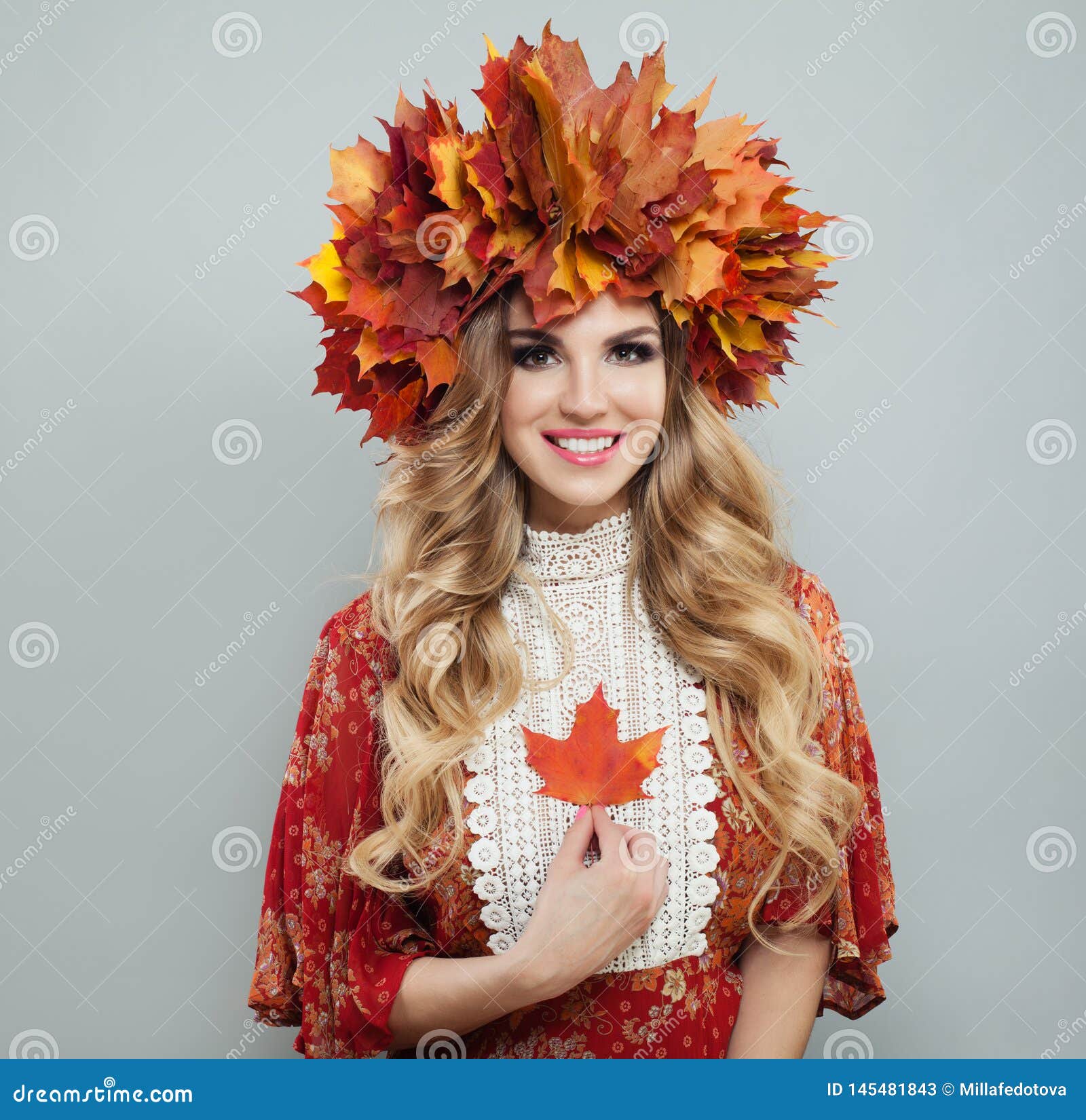 Perfect Autumn Woman In Bright Fall Leaves Crown Holding Red Maple Leaf