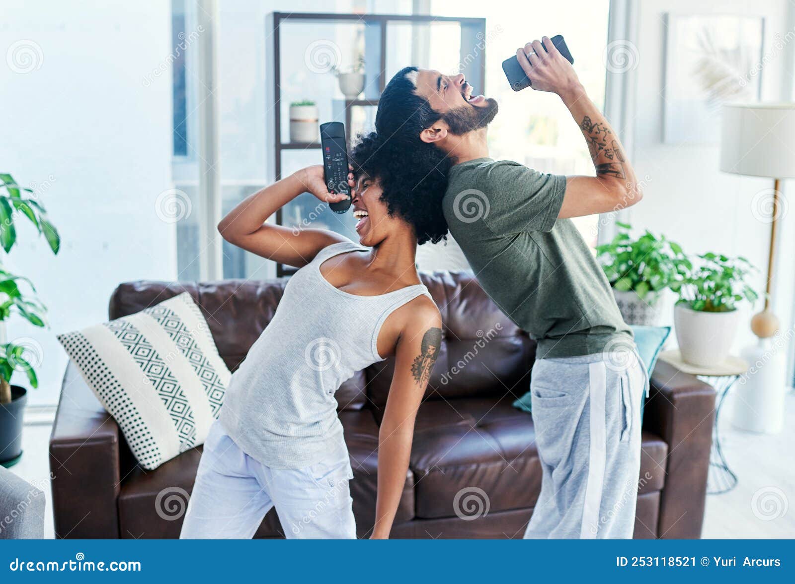 The Perfect Duet. a Couple Having a Sing Along at Home. Stock Image ...