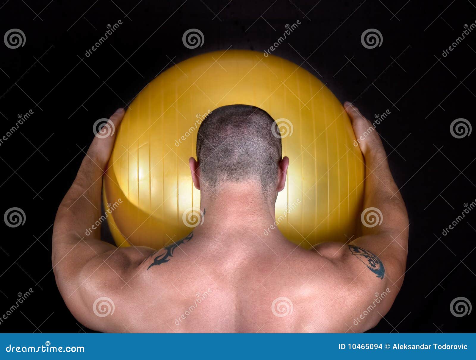 A Perfect Muscular Man with Ball Posing Artistic Stock Photo - Image of ...