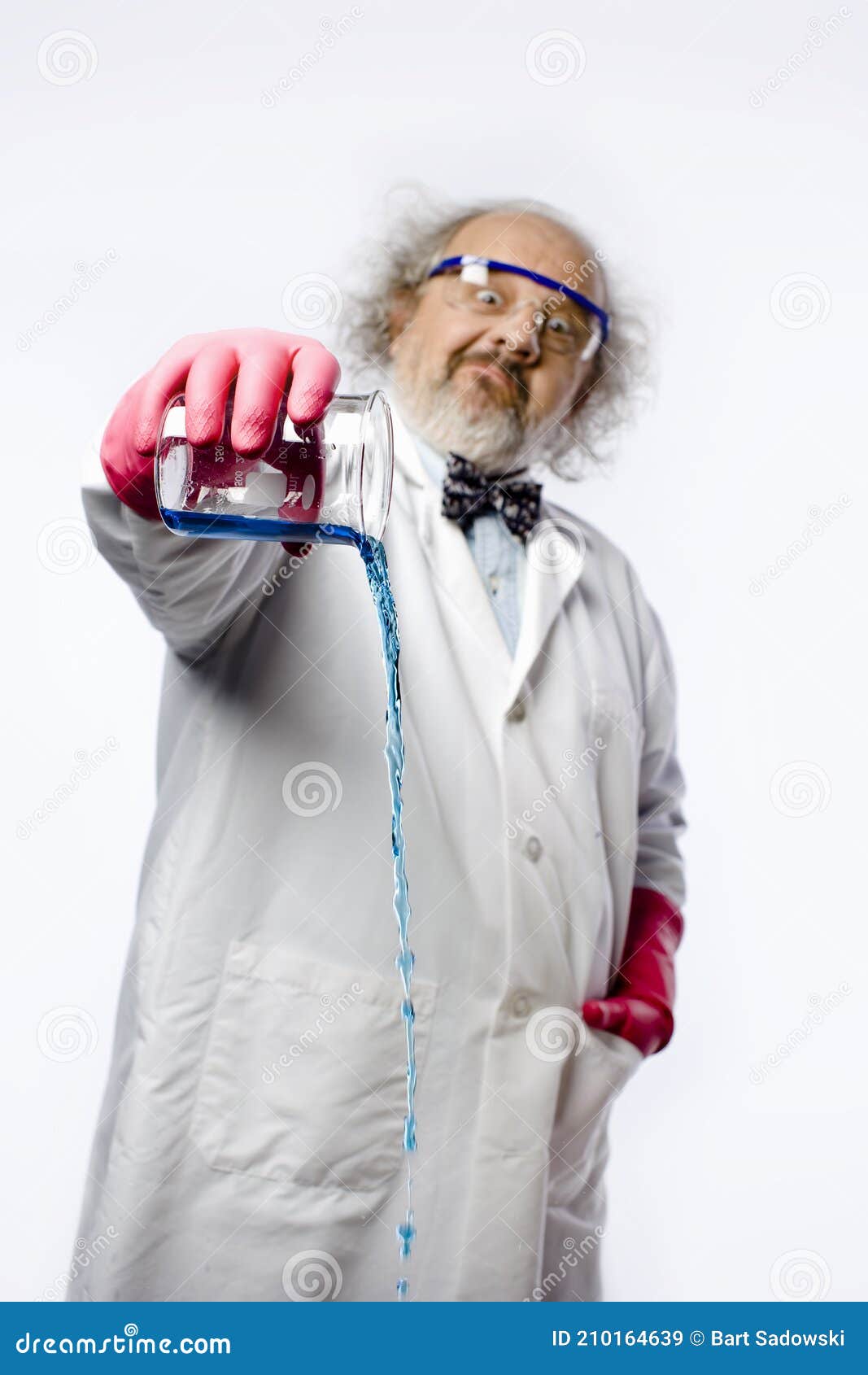 Mad Scientist Pouring Liquid Out of a Beaker Stock Image - Image of ...