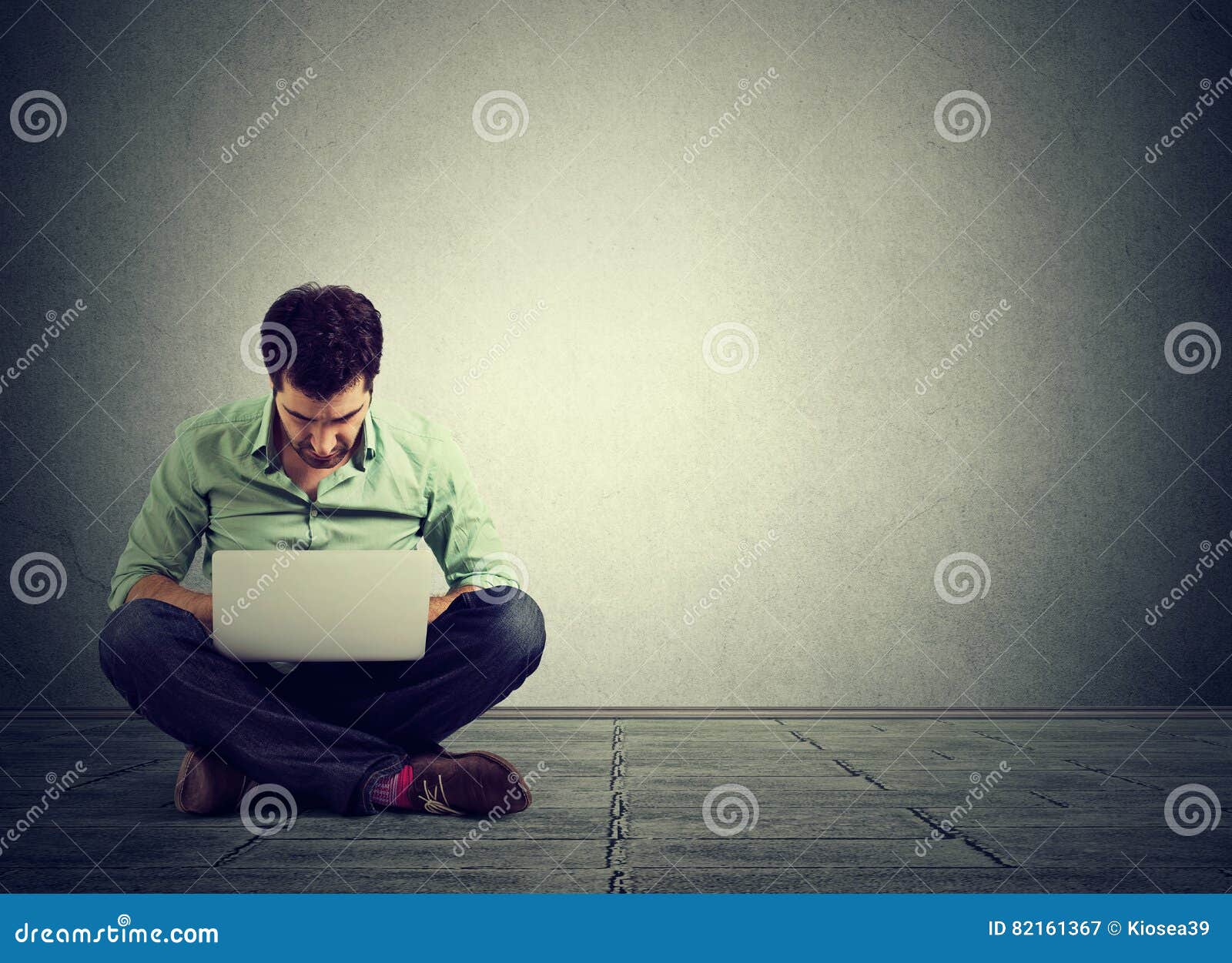 Perfect Technology. Man Sitting on Floor Working on Laptop Computer ...