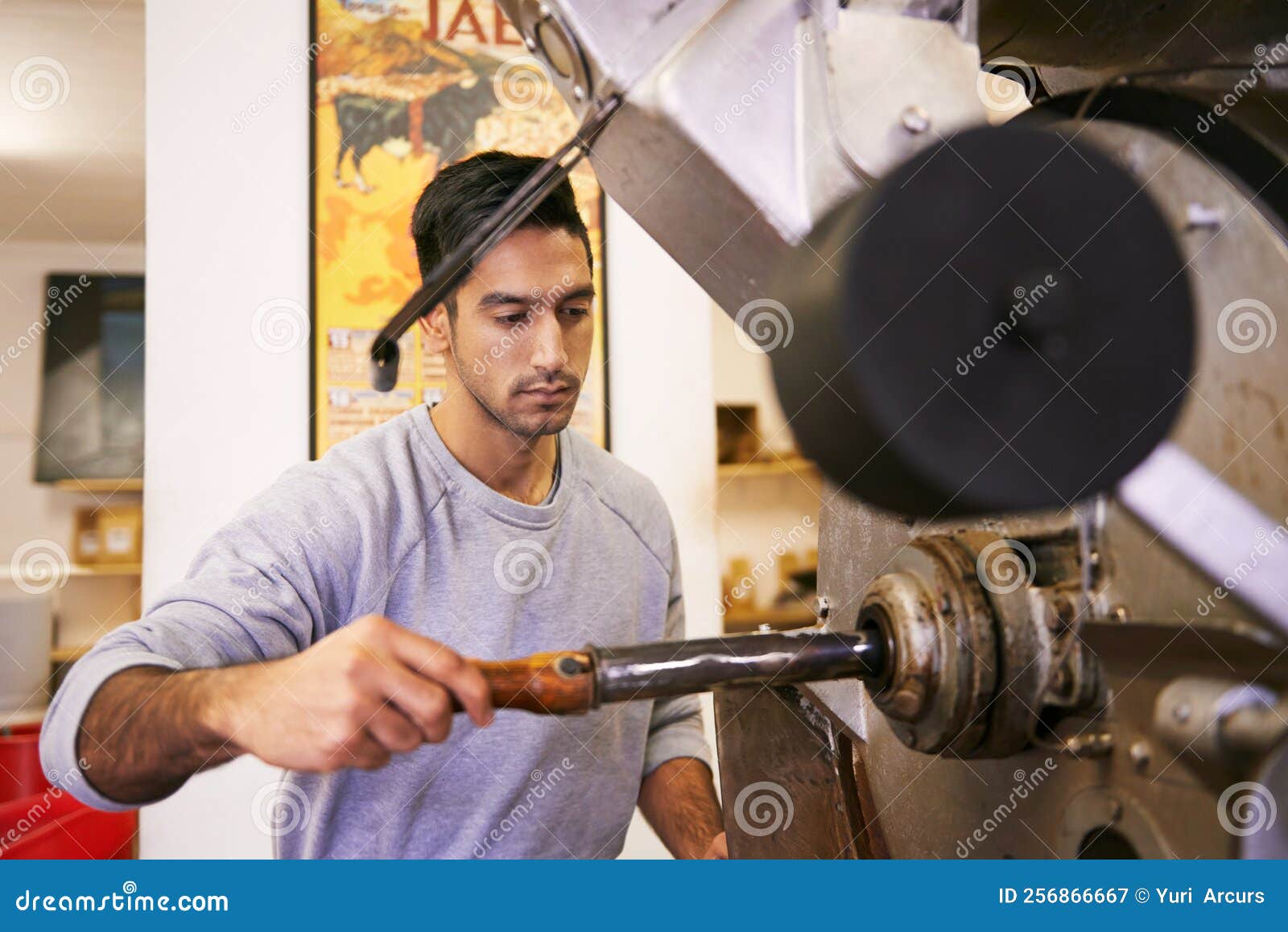 Perfecting the Roast. a Machine Grinding and Roasting Coffee Beans ...