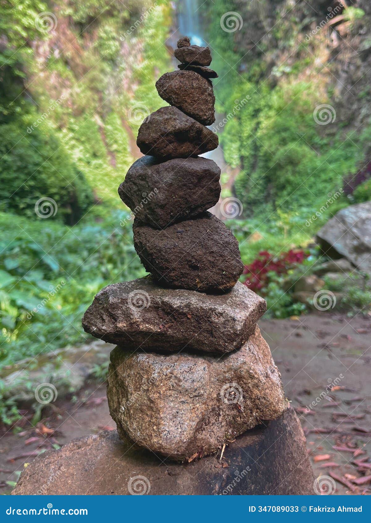 A Perfectly Balanced Stack of Stones Rests in a Serene Forest Stock ...