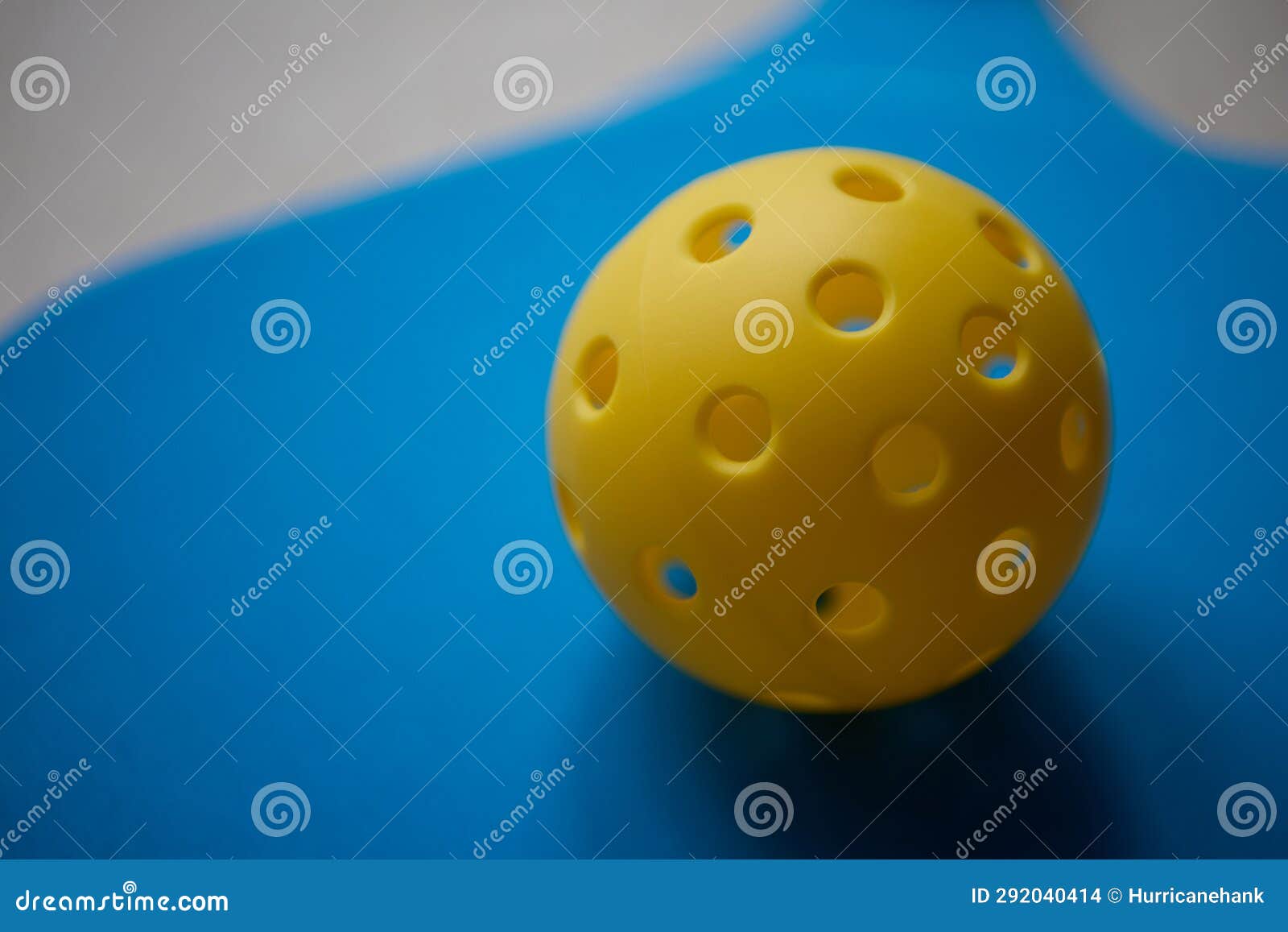 Perforated Plastic Ball for Pickleball in Close Up Stock Photo - Image ...