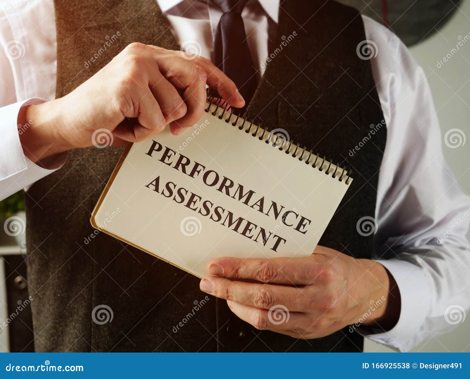 Performance Assessment in the Hands of a Man Stock Photo - Image of ...