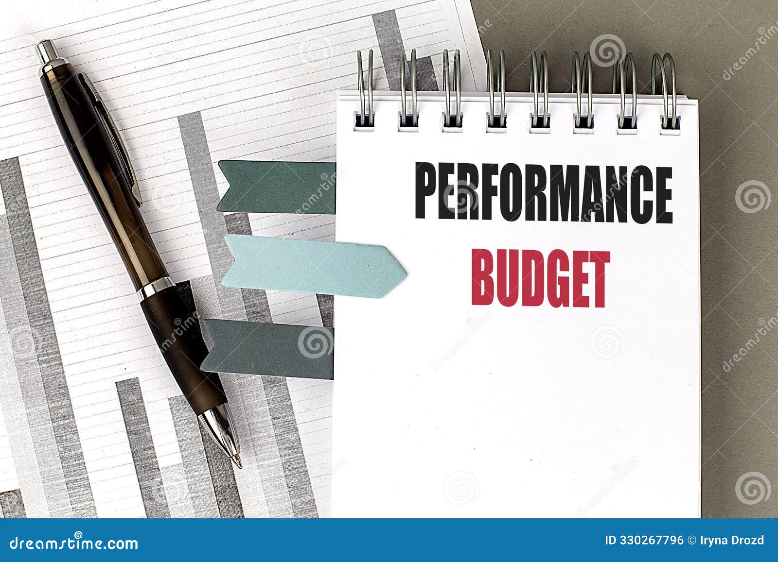 PERFORMANCE BUDGET Text on Notebook with Chart on Gray Background Stock ...