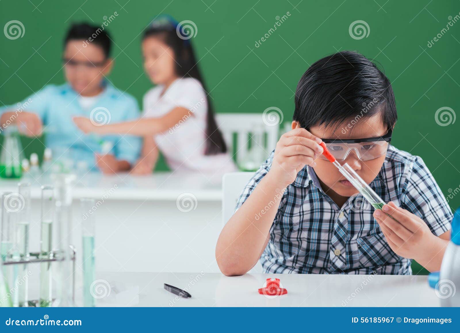Performing experiment stock image. Image of chemistry - 56185967