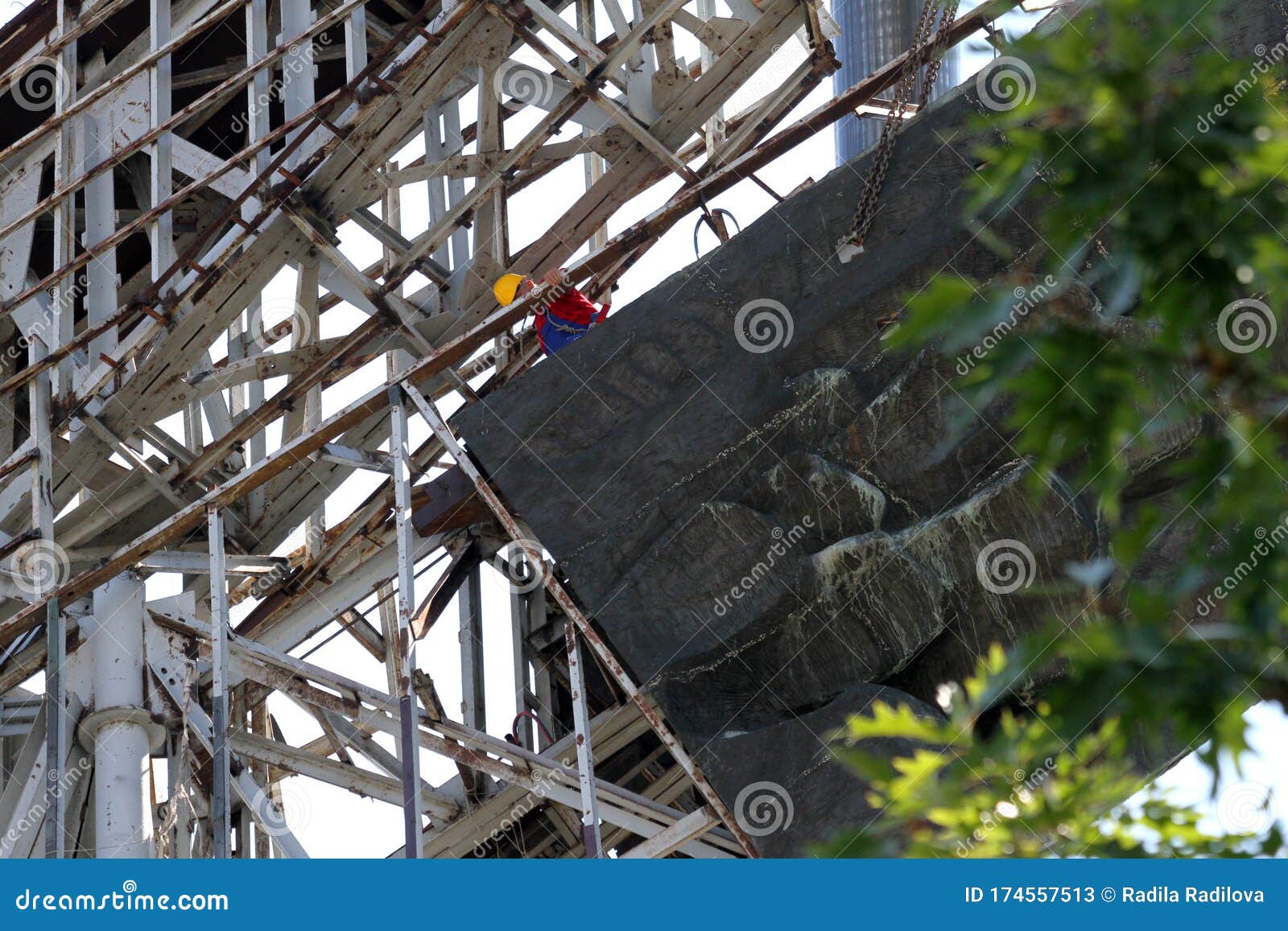 Performing Heavy Construction Work. a Worker Climbs in Height and ...