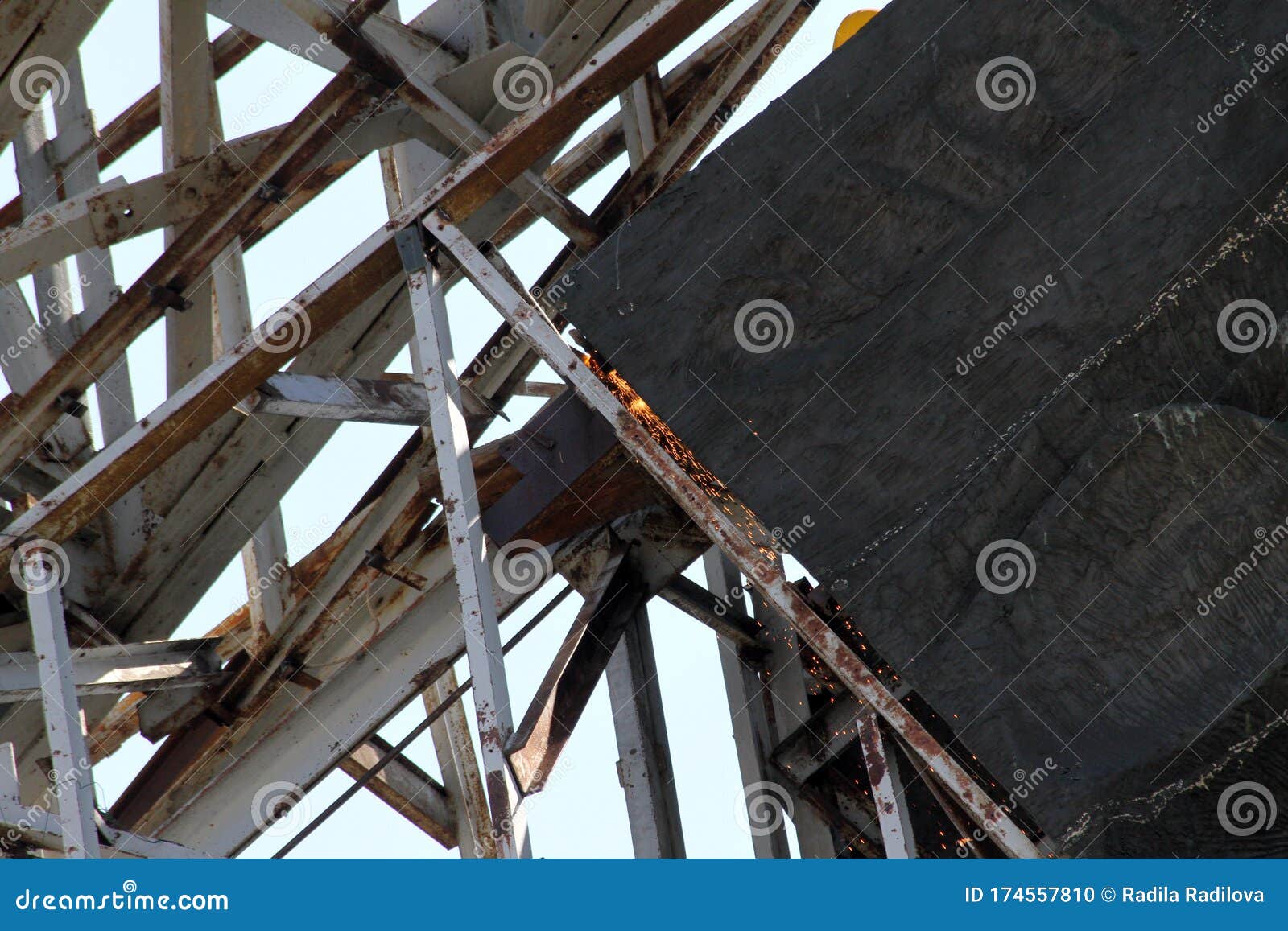 Performing Heavy Construction Work. a Worker Climbs in Height and ...