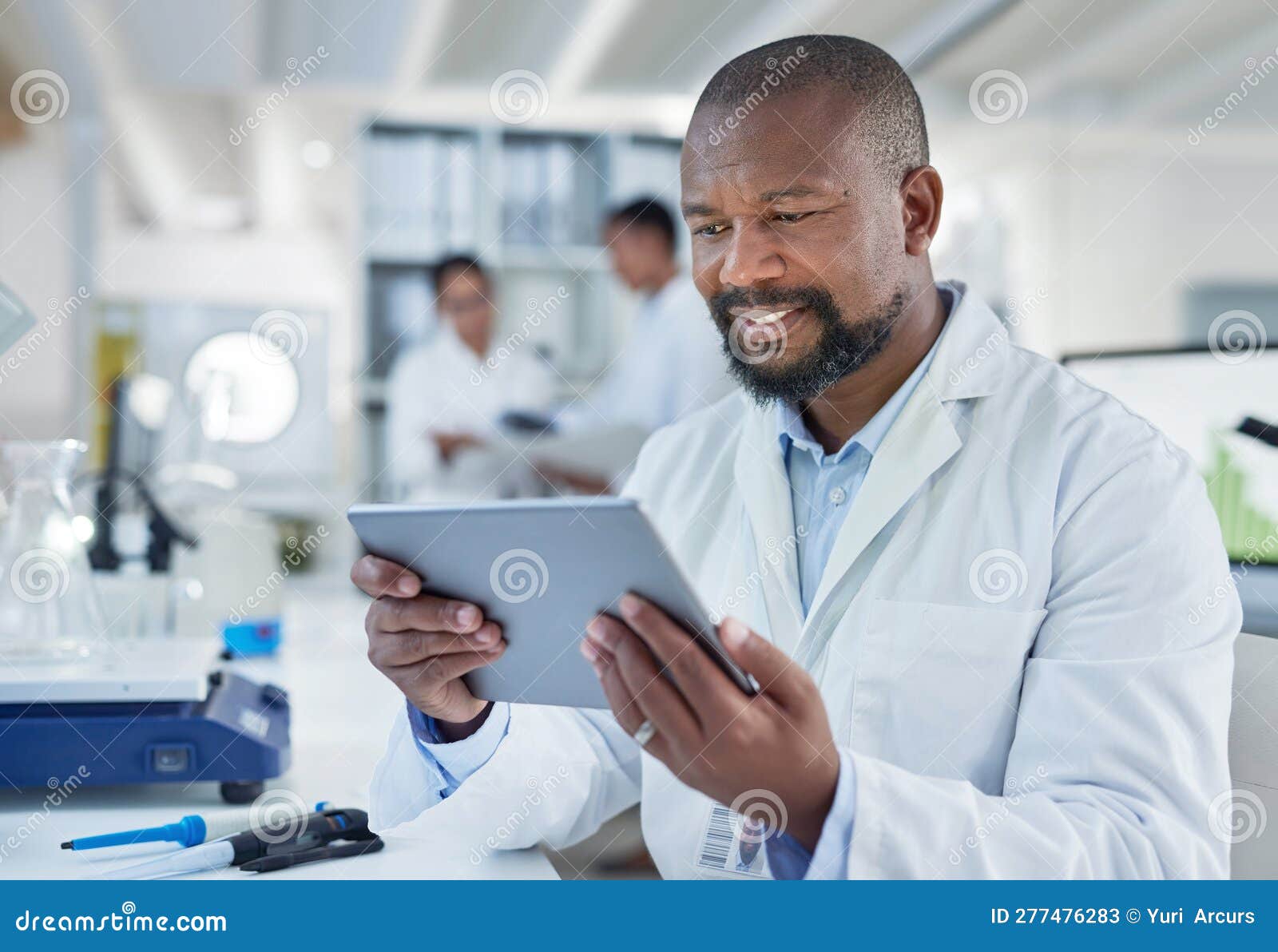 Performing Routine Scientific Research Tasks on His Handy Device. a ...